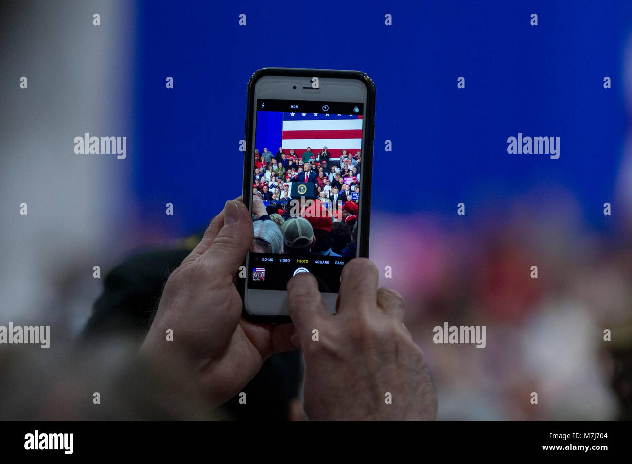 A supporter takes a cell phone picture as United States President ...