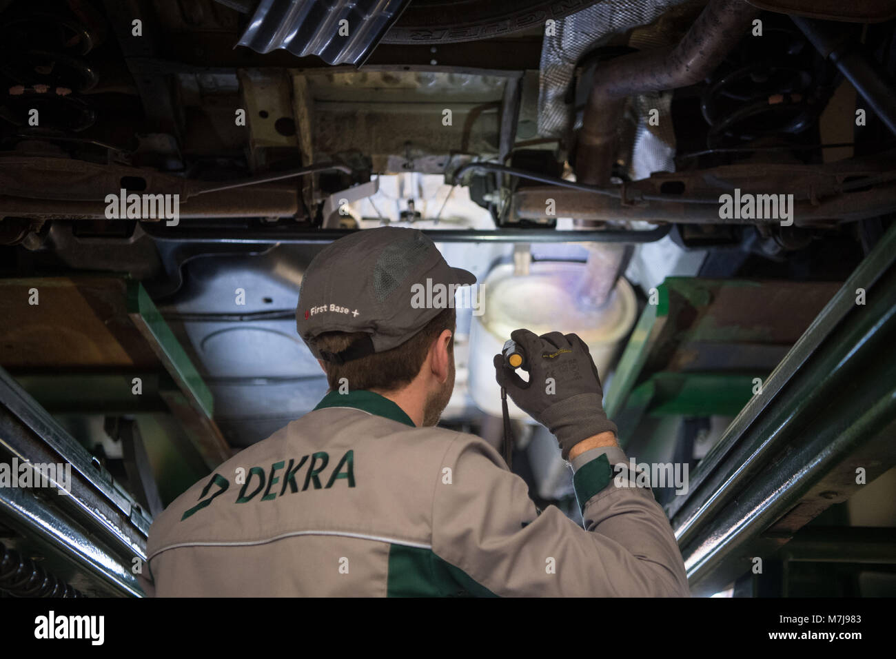 09 March 2018, Germany, Stuttgart: An employee of the vehicle ...