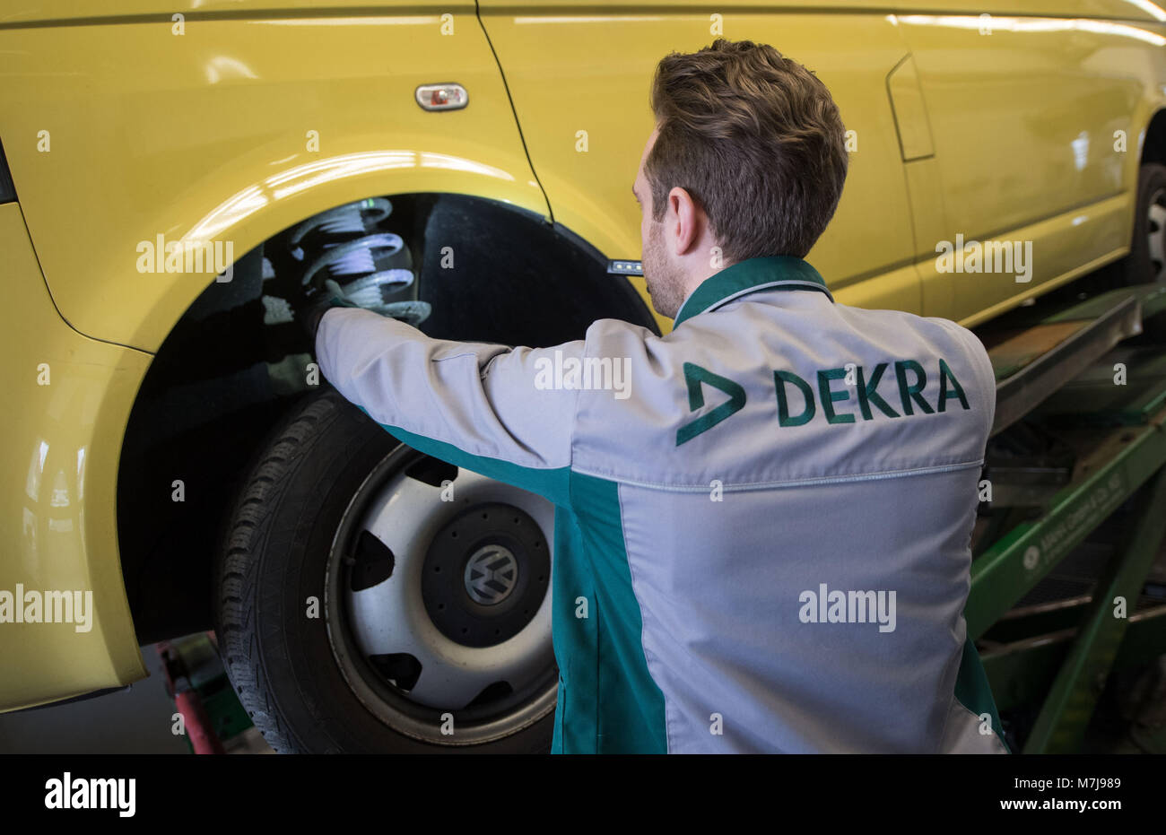 09 March 2018, Germany, Stuttgart: An employee of the vehicle ...