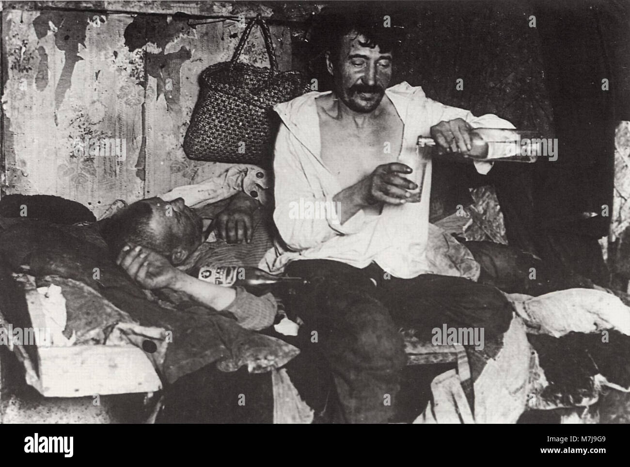 A photograph from around 1904 depicting a night shelter in the slums of ...