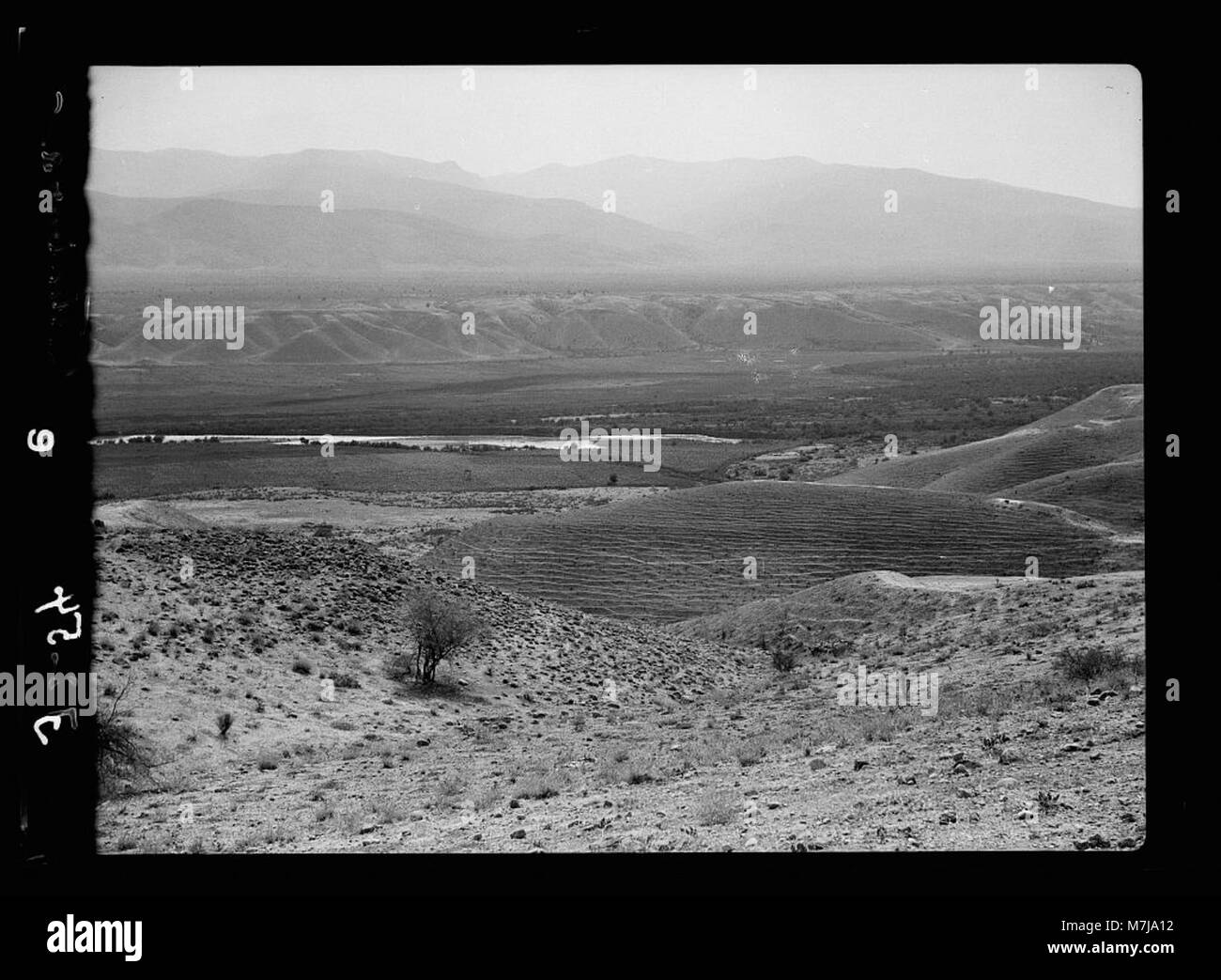 A photograph depicting the Jordan Valley, showing the landscape from ...