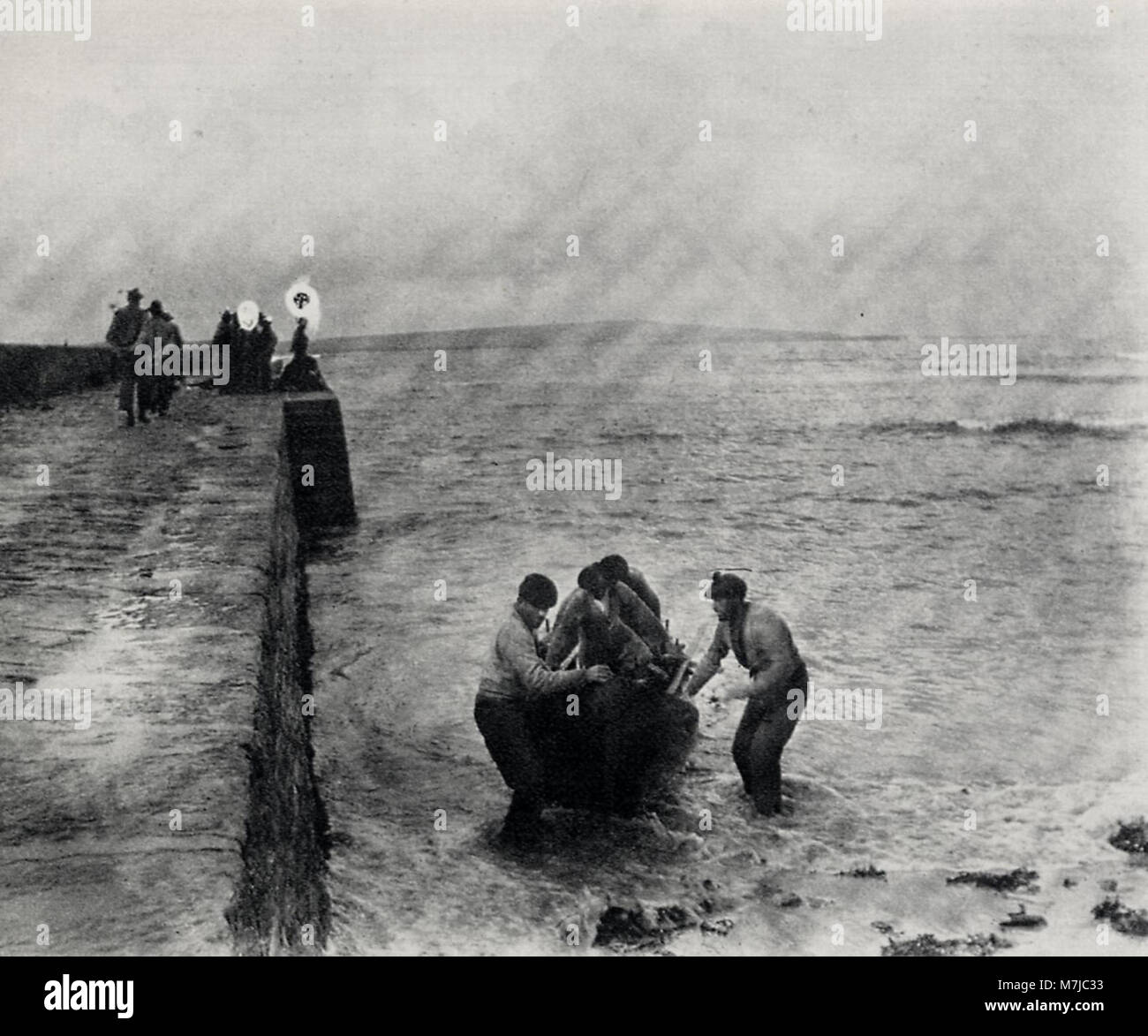 A photograph of playwright John Millington Synge with a 'currach', a ...