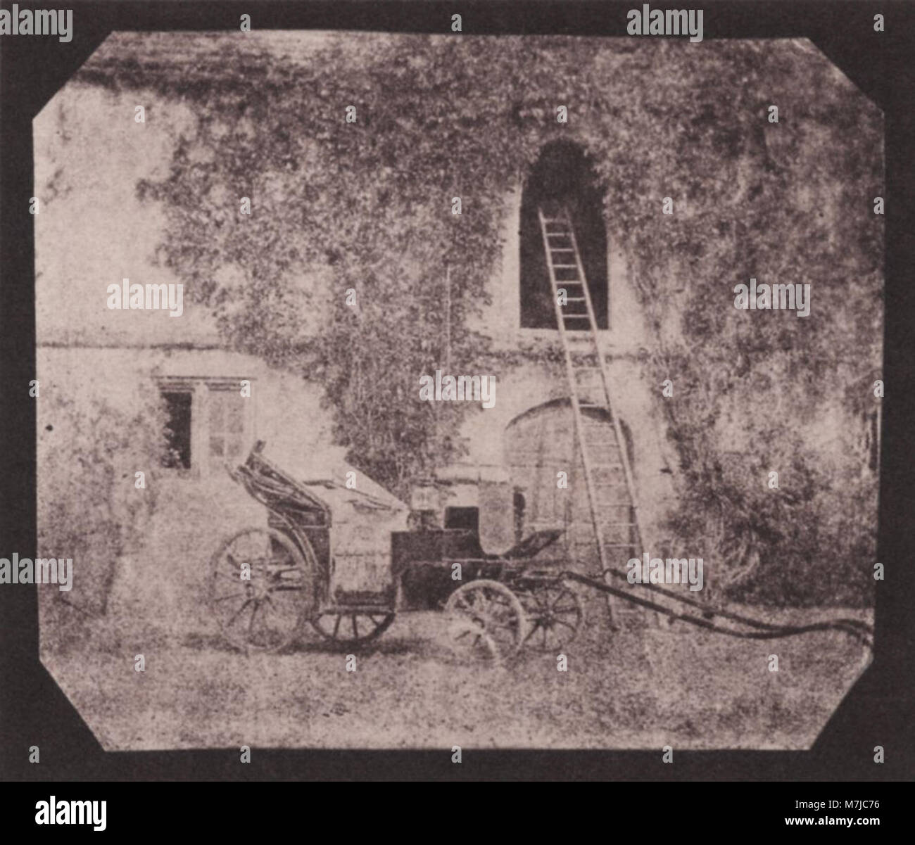 A photograph by William Henry Fox Talbot showing a carriage with a ...