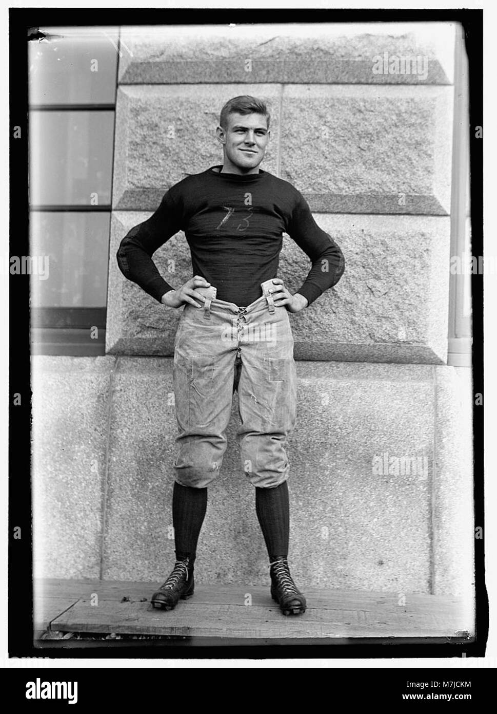 This image shows the Naval Academy football team, with players, coaches ...