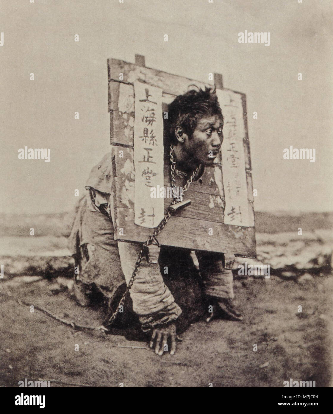 The photograph titled *Der Pranger*, captured by John Thomson, depicts ...