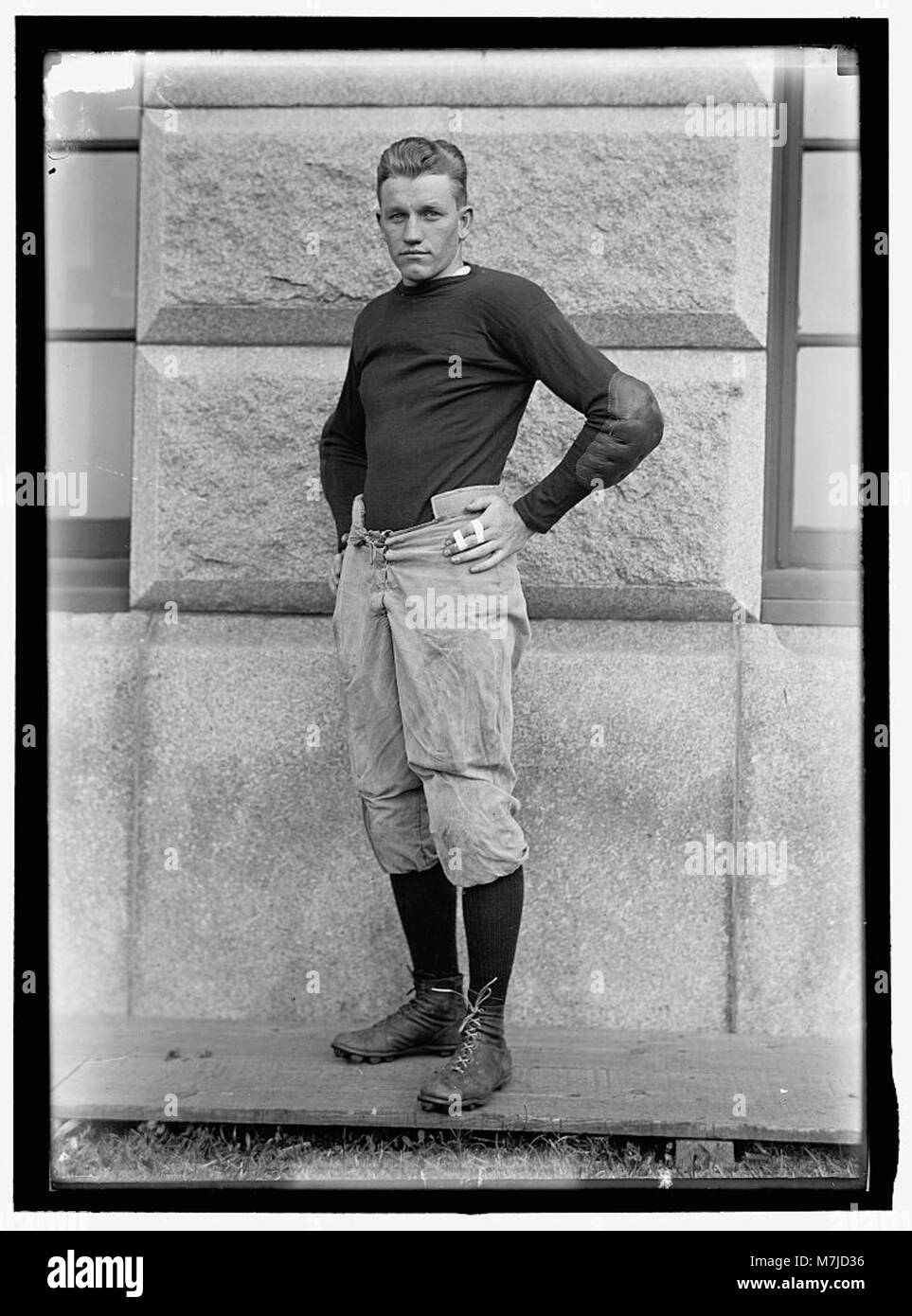 This image showcases the Naval Academy football team, including players ...