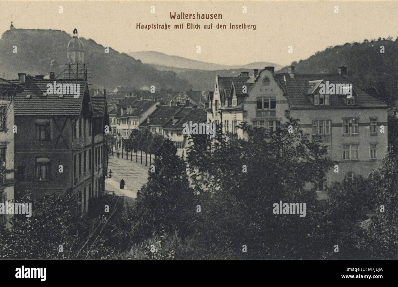 A vintage postcard showing the Hauptstraße (Main Street) and Inselberg ...