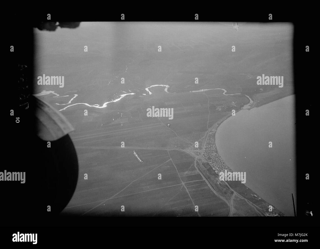 A high aerial view of the Jordan River's outflow from the Sea of ...