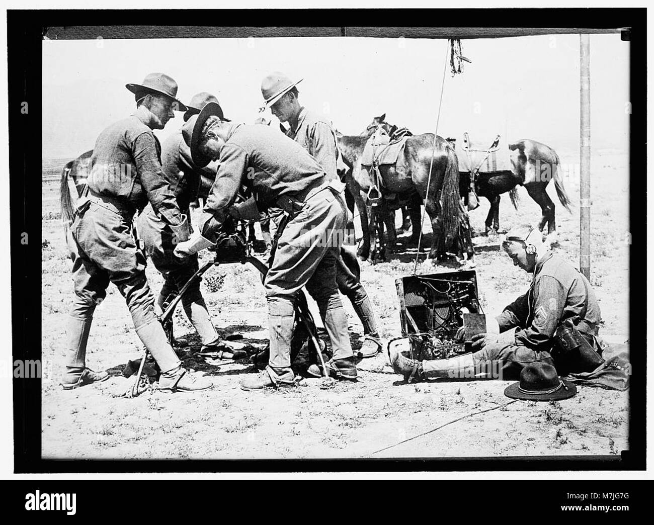 A photograph showing the U.S. Signal Corps constructing communication ...