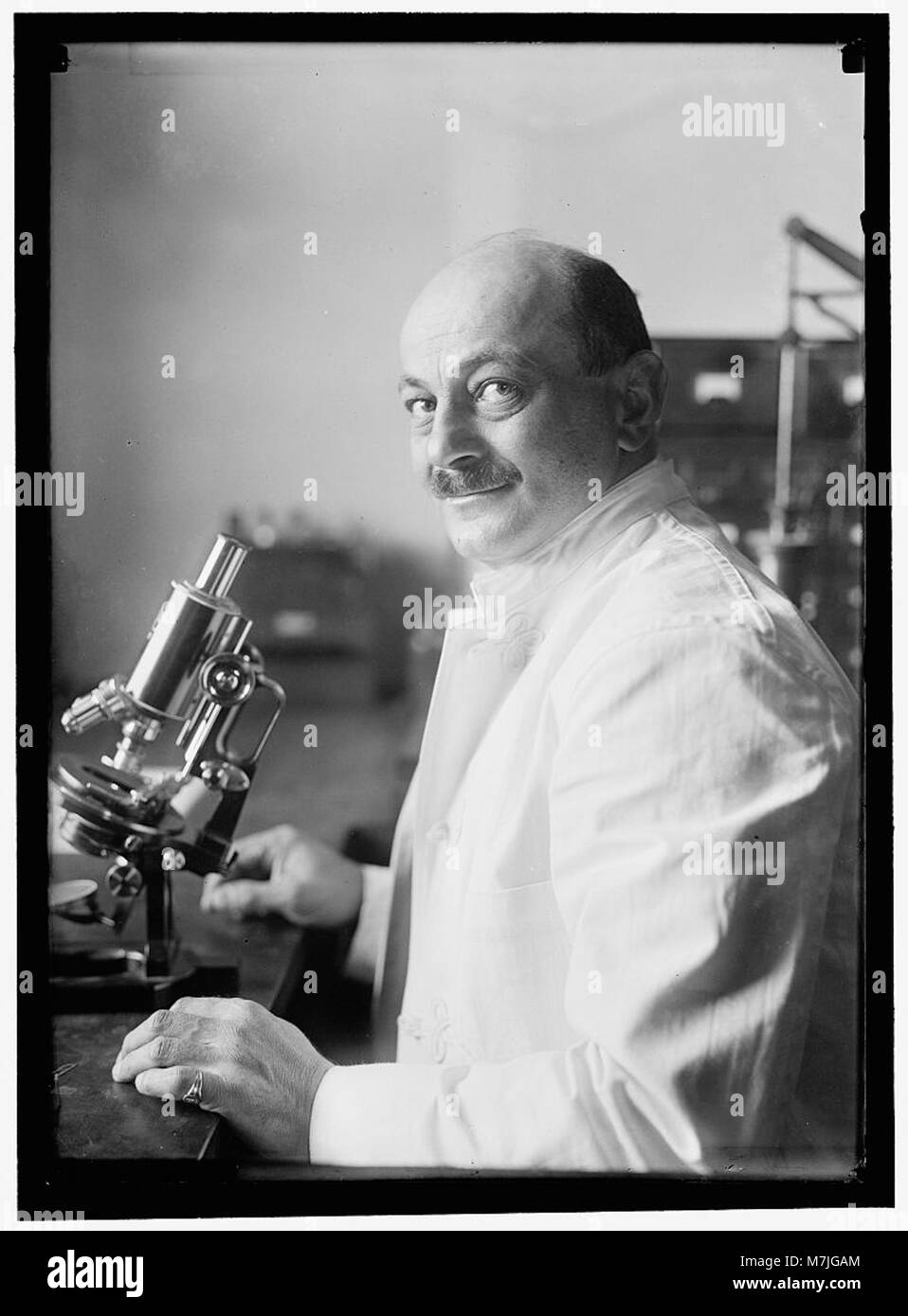 This photograph shows a bacteriologist at George Washington University ...