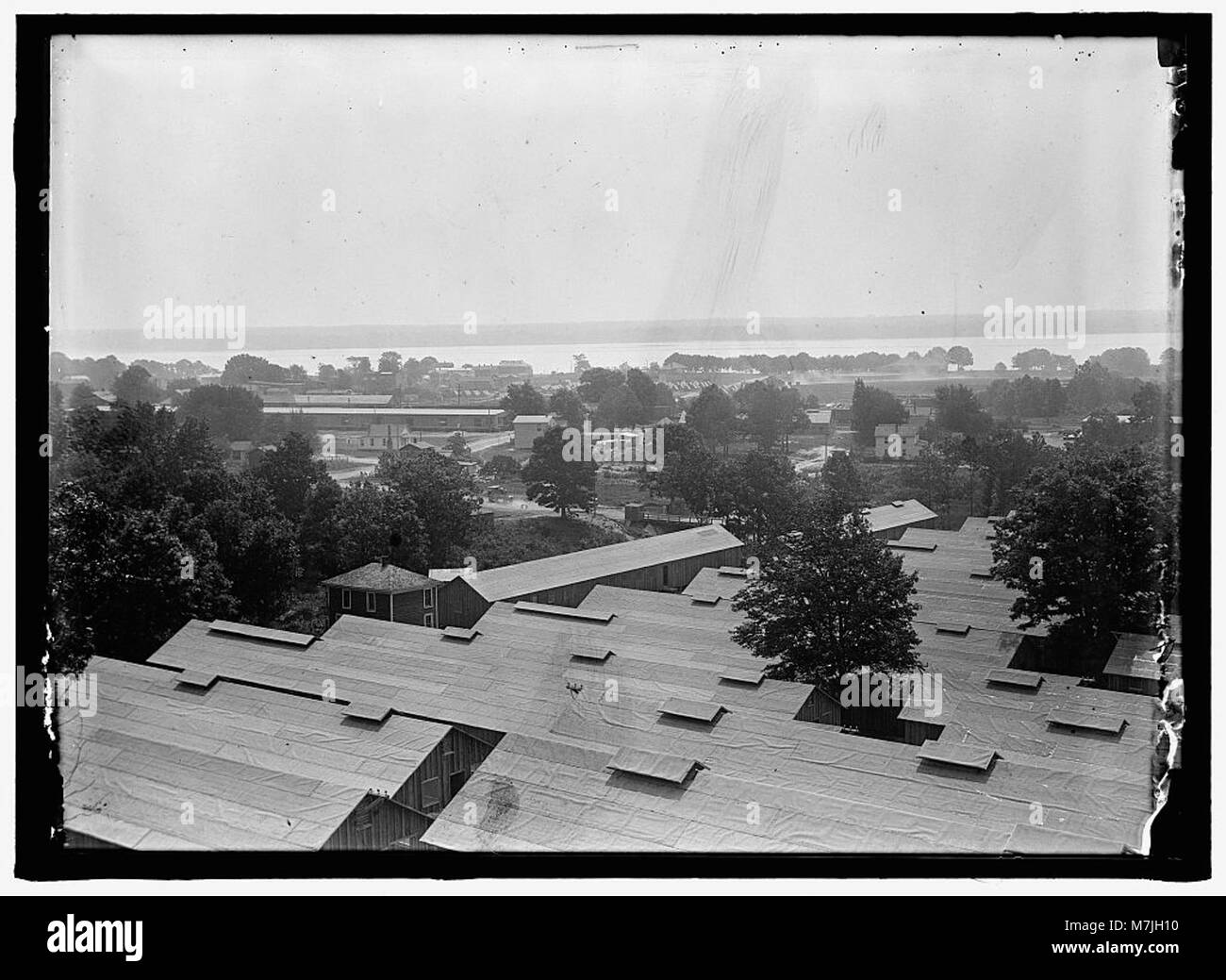 A photograph of a military or civilian camp, capturing the daily life ...