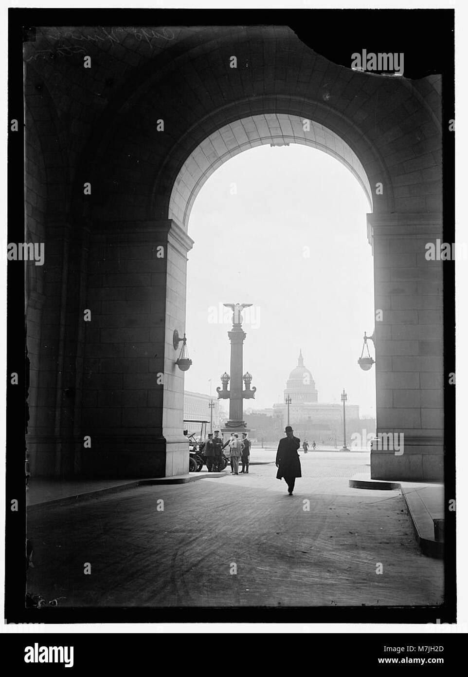 A photograph of the U.S. Capitol viewed through the arch at Union ...