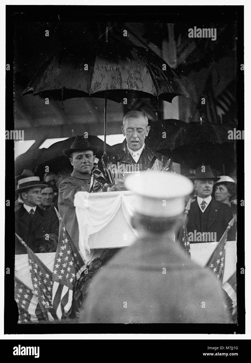 This image shows President Wilson giving a Flag Day address in the rain ...