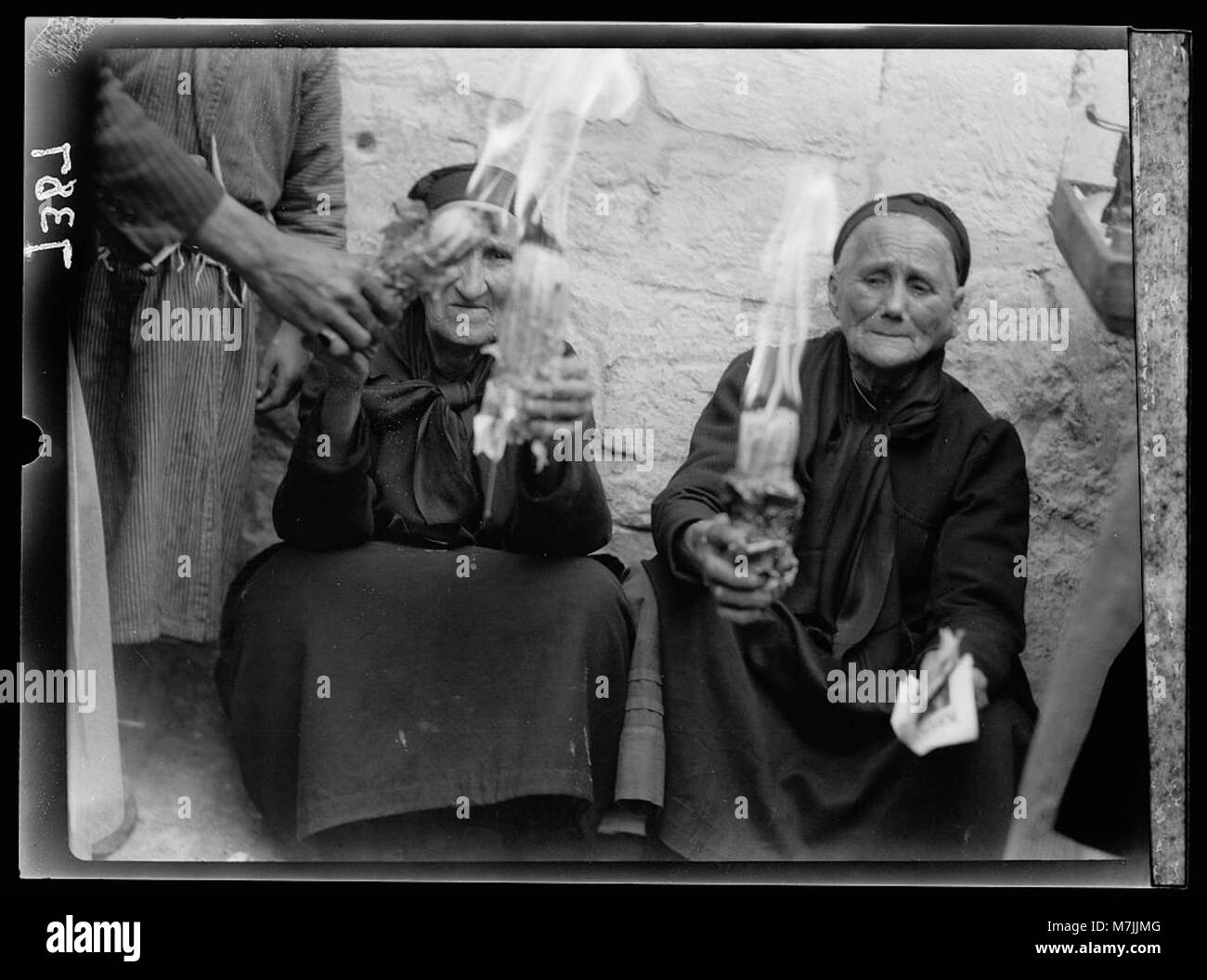 Two elderly women carrying the 'Holy Fire' during the Orthodox ...