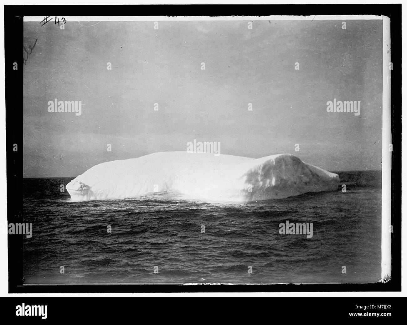 A dramatic photograph of an iceberg, showcasing the natural beauty and ...