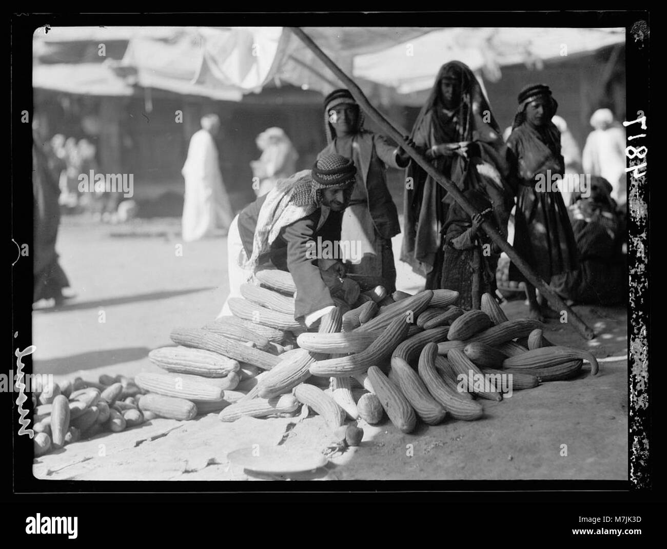 This scene captures the vibrant bazaars of Mosul, Iraq, showing a ...