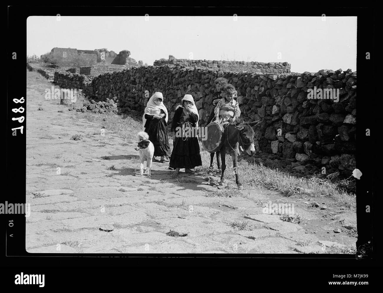 A photograph showing Druze children playing on the Roman street of the ...