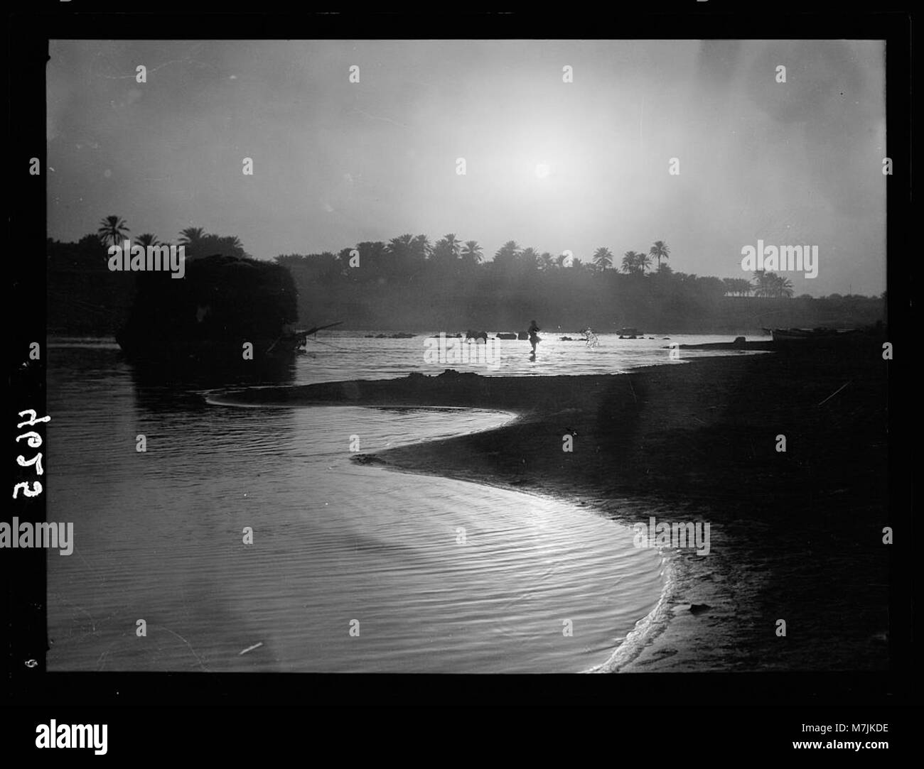 The photograph captures a serene scene of the Tigris River in Baghdad ...