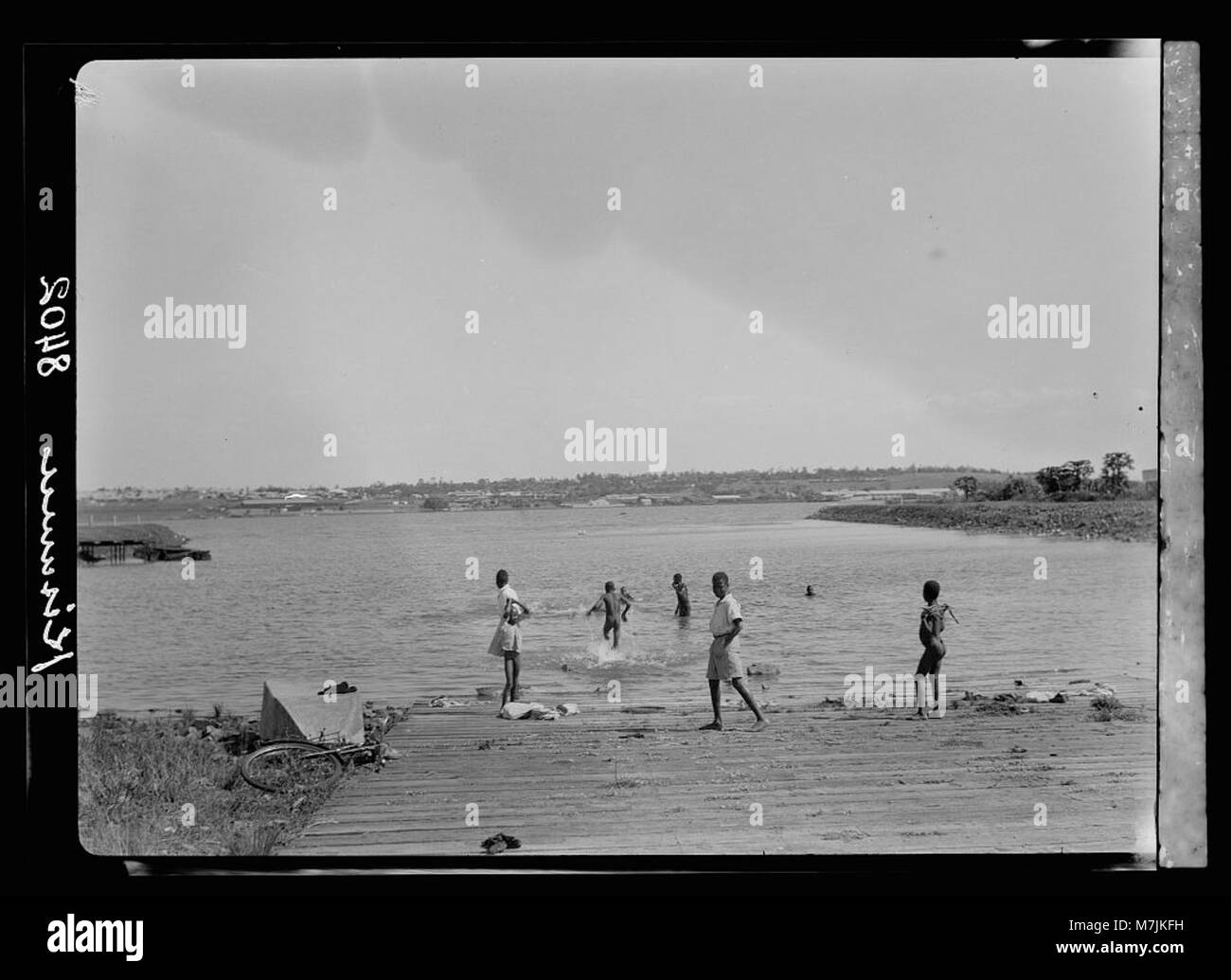 A scene from Kisumu, Kenya Colony, shows native boys bathing across the ...