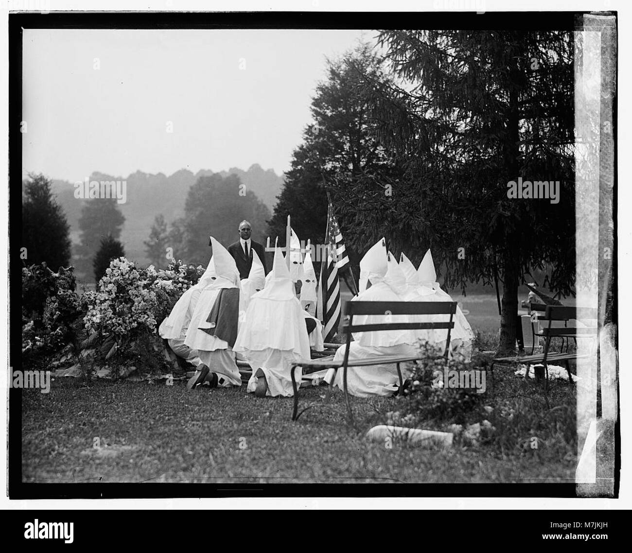 A photograph depicting a funeral associated with the Ku Klux Klan ...