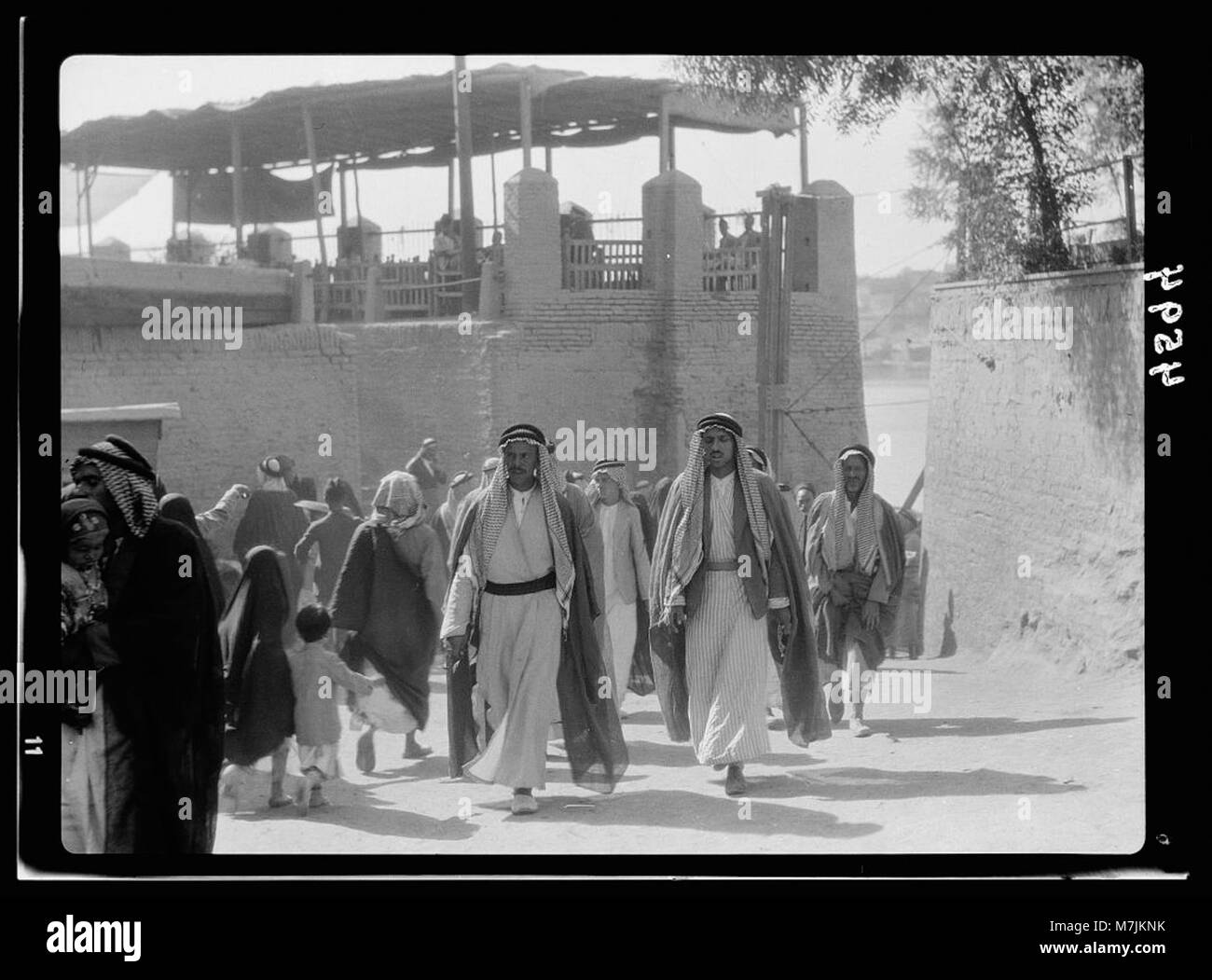 Street scene in Baghdad, Iraq, showing people coming off the Katah ...