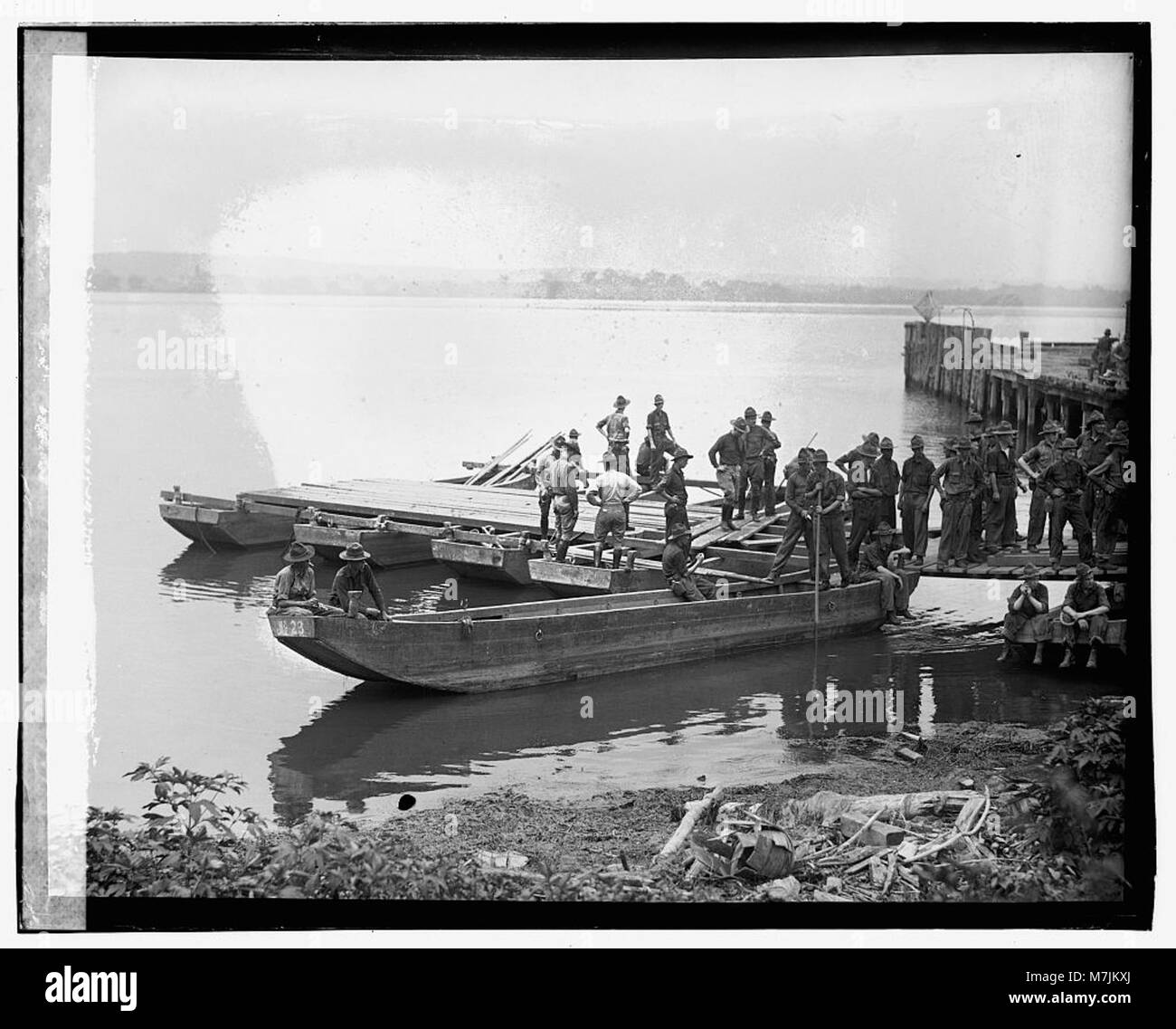 U.S. Marines constructing pontoon bridges, showcasing their engineering ...
