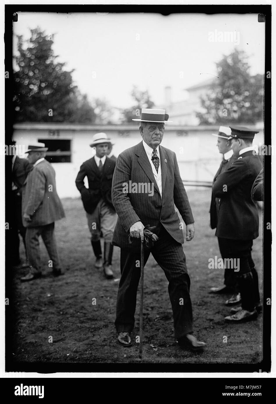 A photograph of Judge William H. Moore presiding over a horse show ...