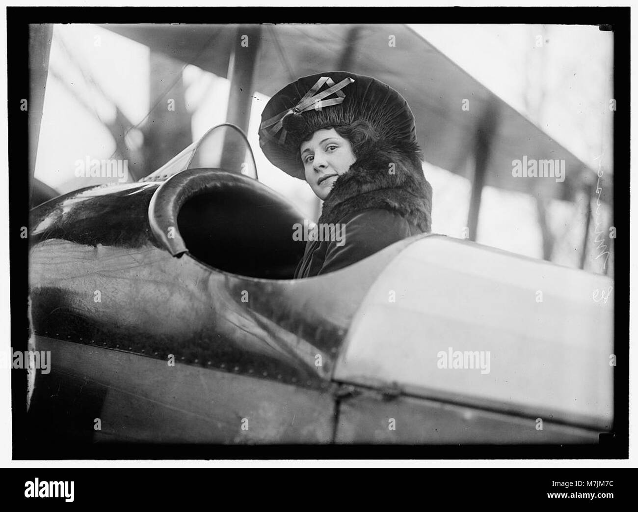 This image shows Edna Munsey in an airplane, likely capturing a moment ...