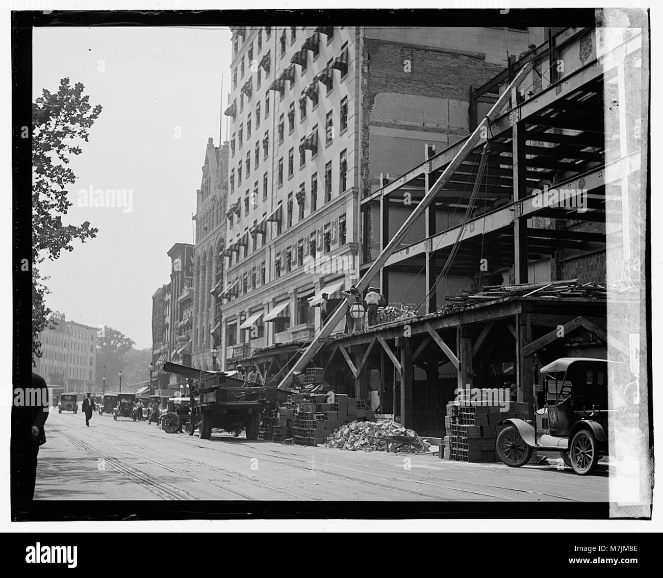 This image depicts the National Theater, with an iron beam falling ...