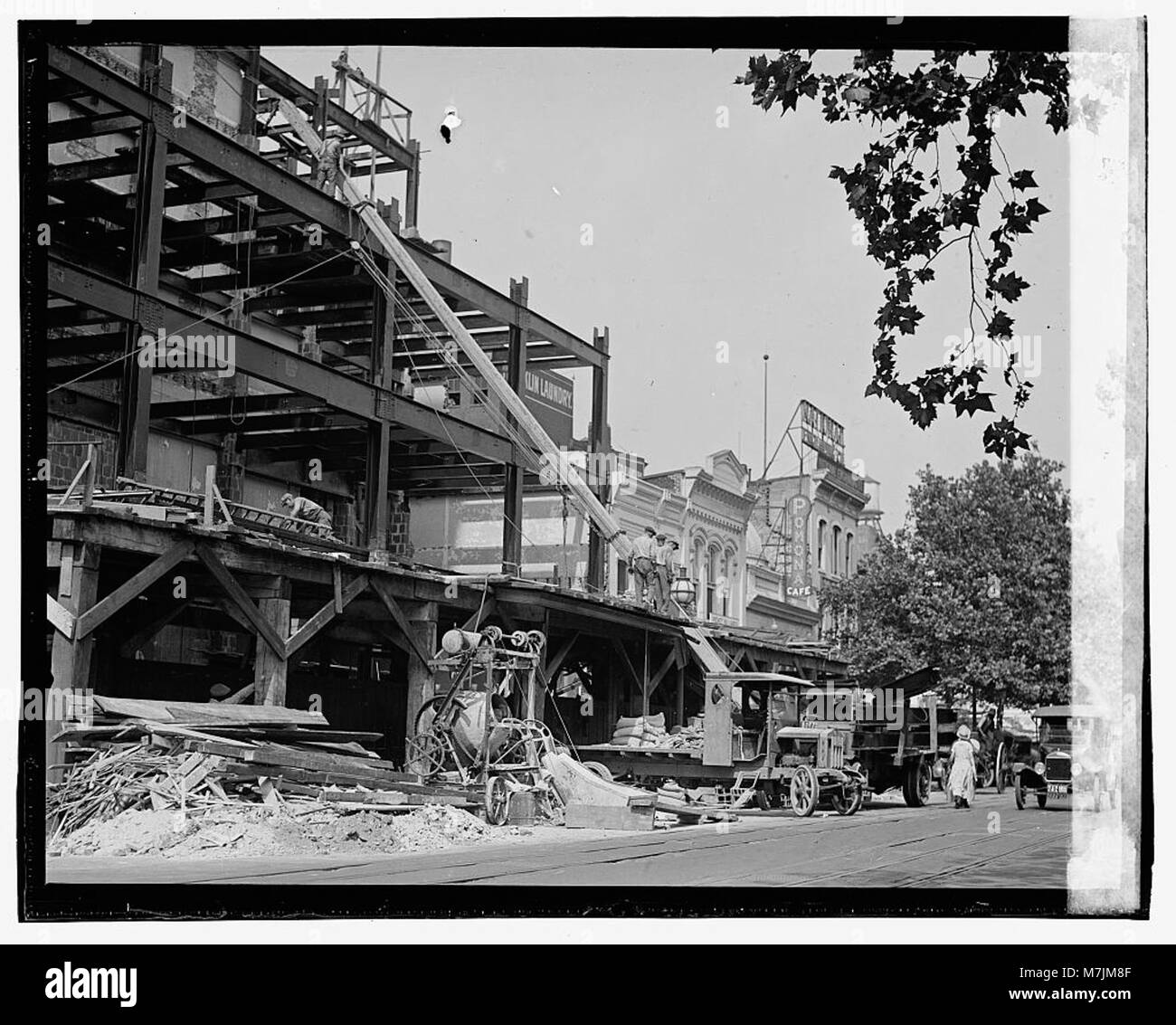 This image captures the dramatic moment of an iron beam falling at the ...