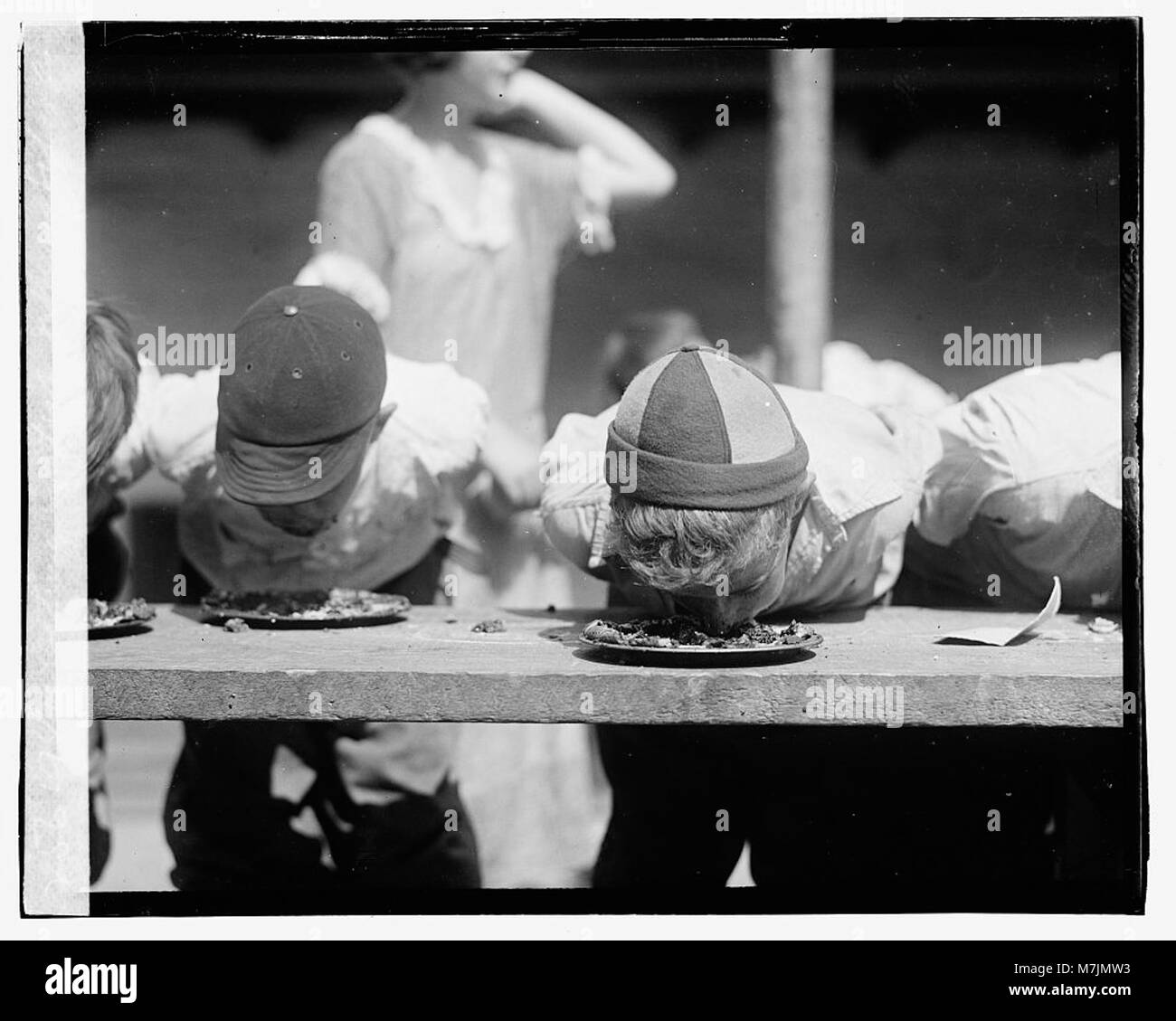 A photograph of a pie-eating contest held at Jefferson School on August ...