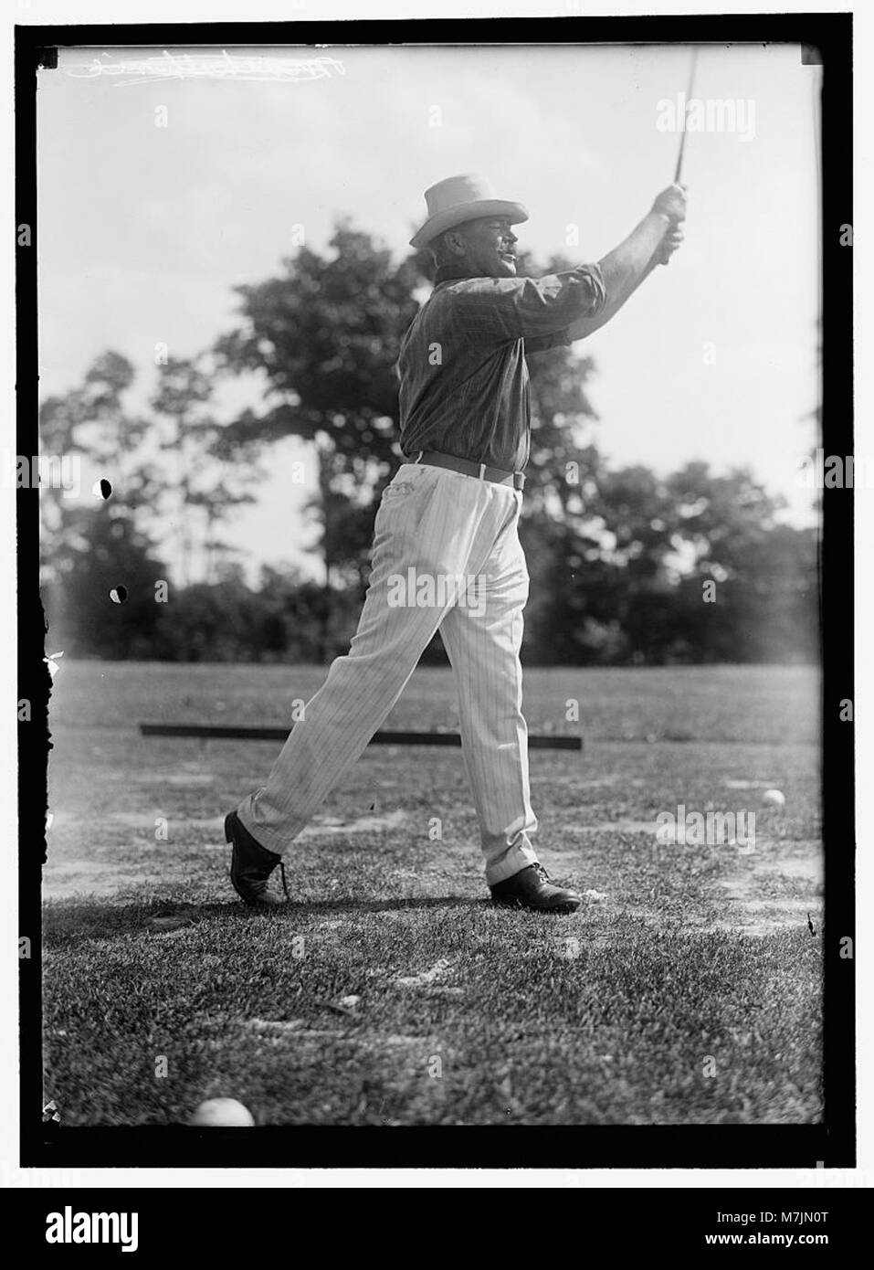 Photograph showing individuals playing golf, an emerging sport in the ...