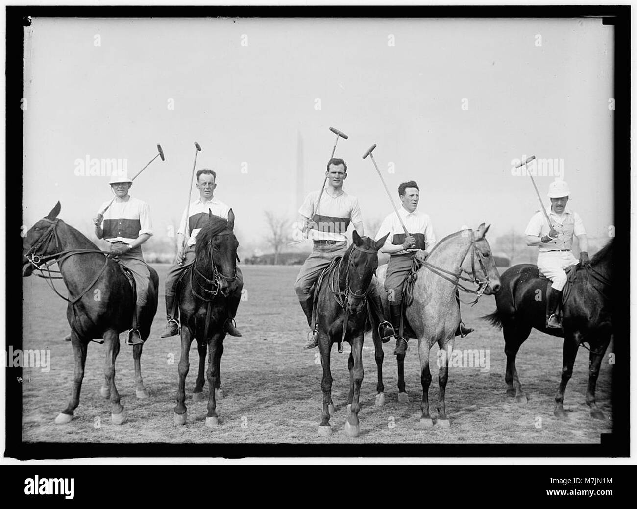 The image features a polo match, showcasing the sport of polo, a team ...