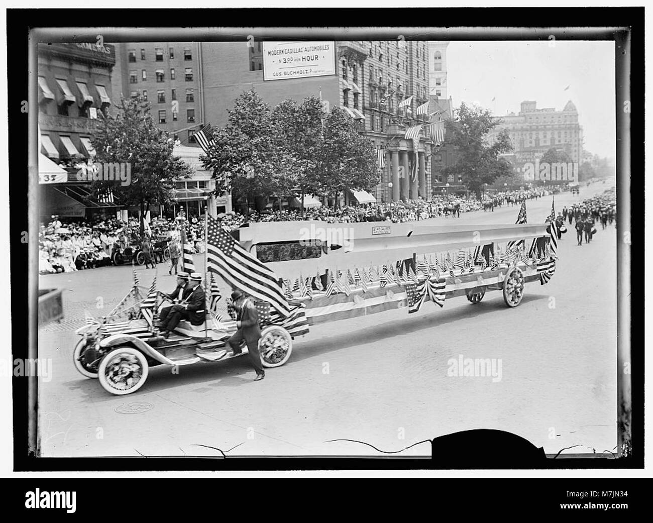 The Preparedness Parade features a float with a large gun, symbolizing ...