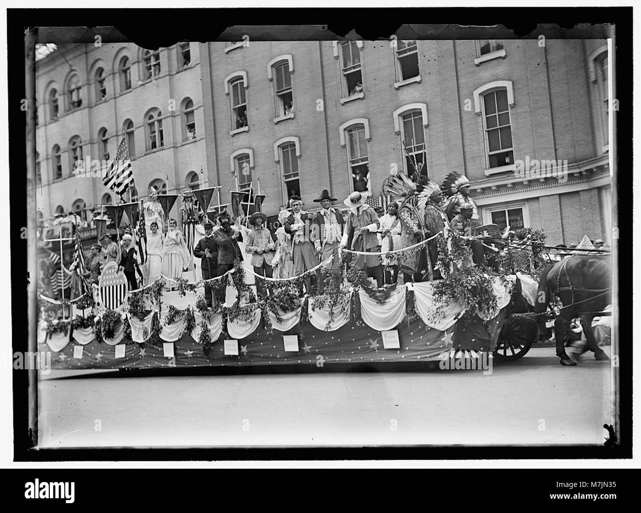 A photograph of a preparedness parade featuring colonial and Indian ...
