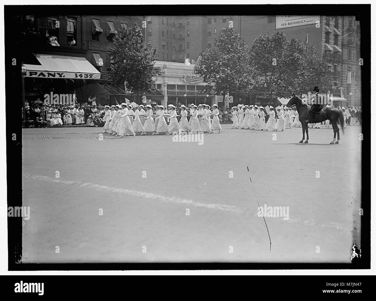This image captures a preparedness parade where many women are seen ...