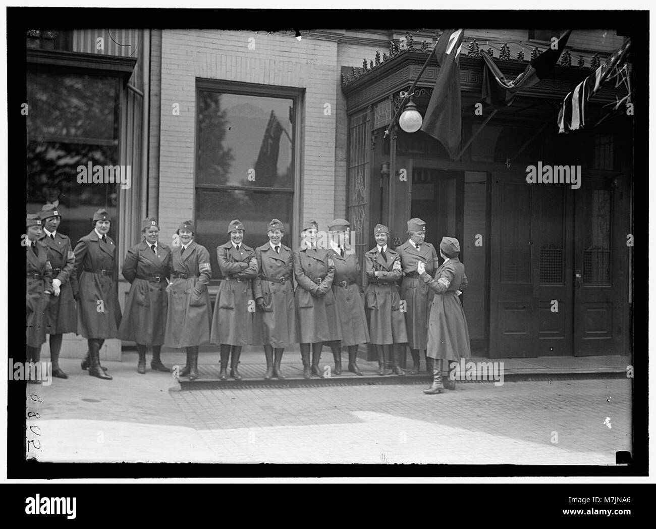 A group of volunteers from the Red Cross Motor Corps, showing their ...
