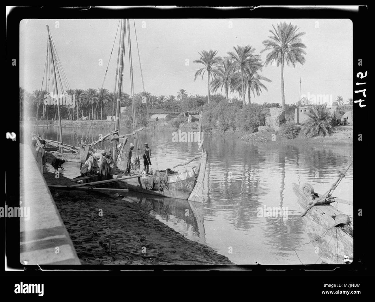 This image captures typical riverboats on the Euphrates River near ...