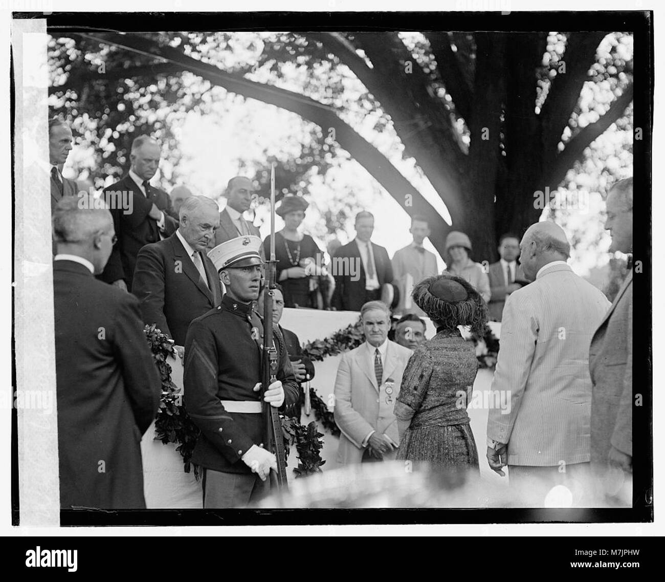 A photograph capturing the unveiling of a zero milestone, a significant ...