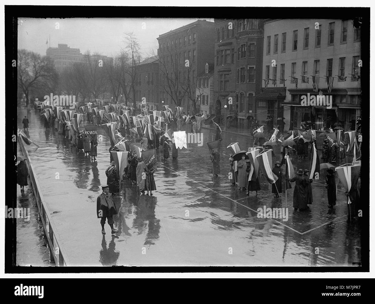The image depicts women marching in the rain, a key moment in the ...