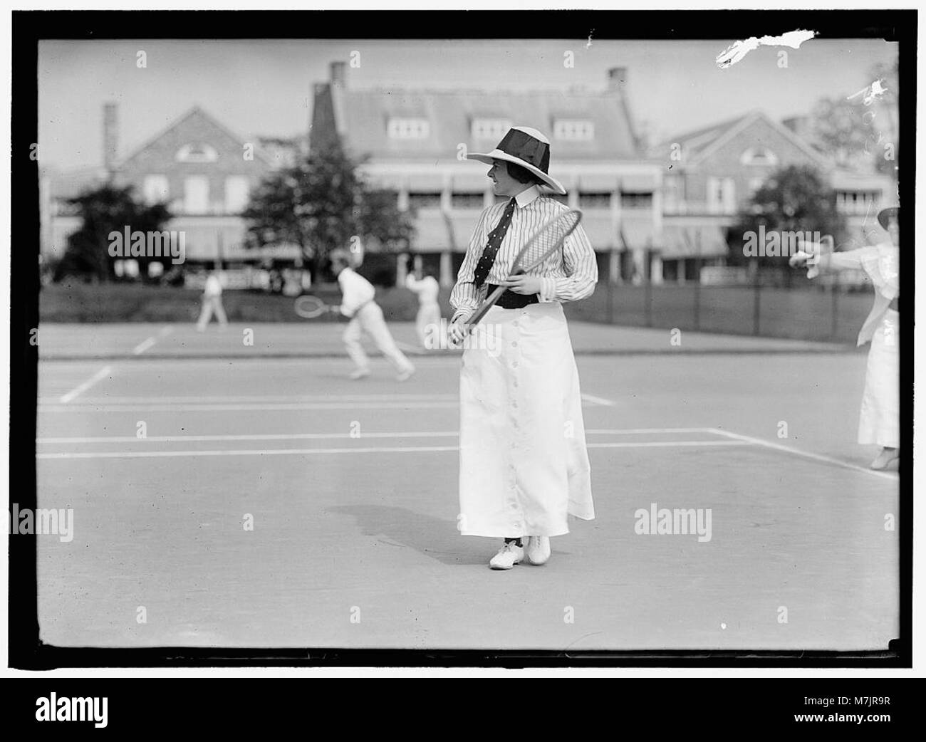 A photograph of Miss Frances Lippett participating in a tennis ...
