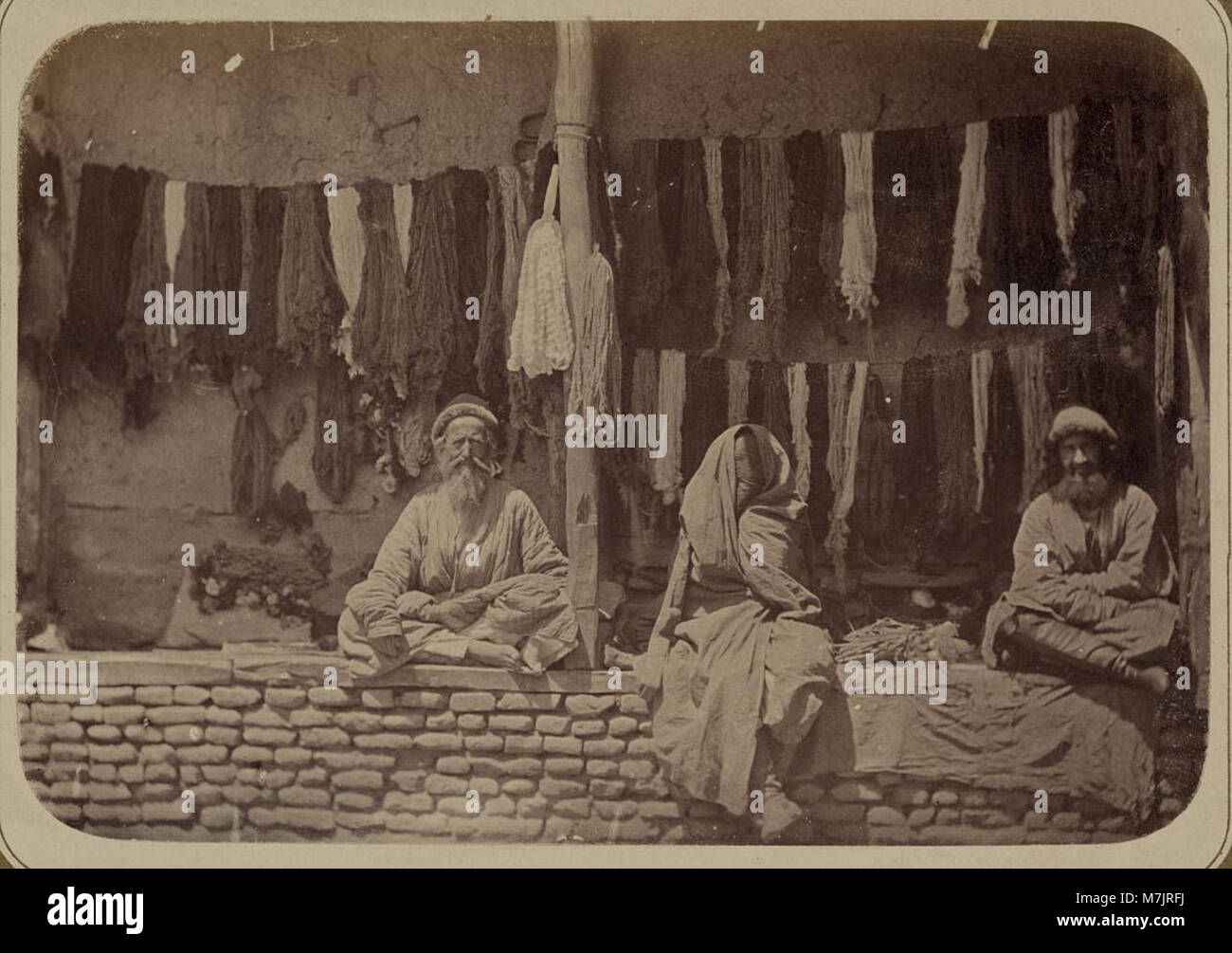 This image depicts a scene of traditional silk trade, highlighting the ...