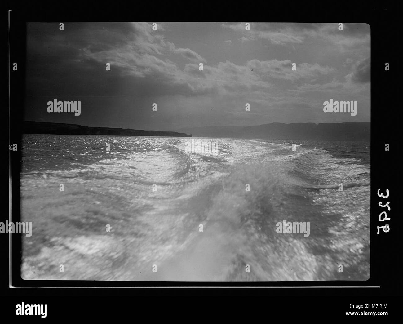 This photograph captures a motorboat trip around the Dead Sea, focusing ...