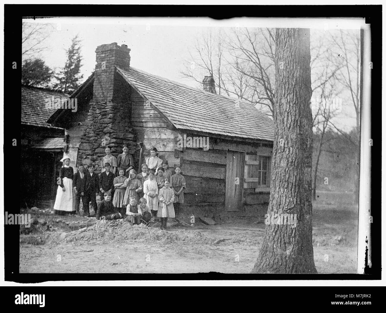 A photograph showing a cabin in the mountains, with a family of 15 ...