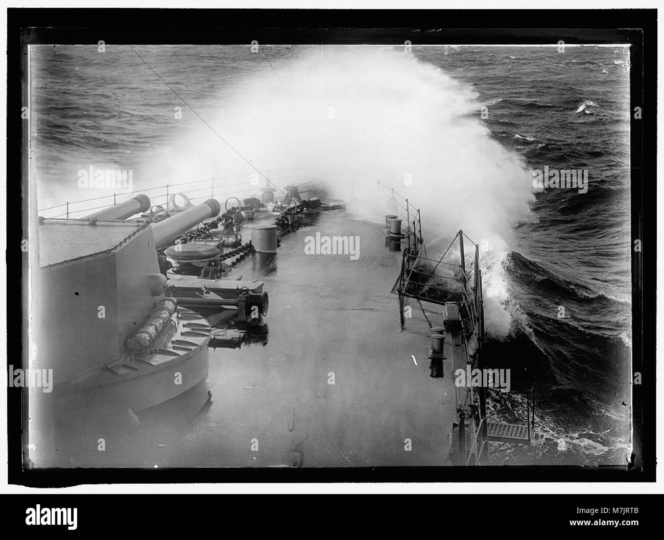 This image depicts U.S. battleships caught in a storm at sea. The ...