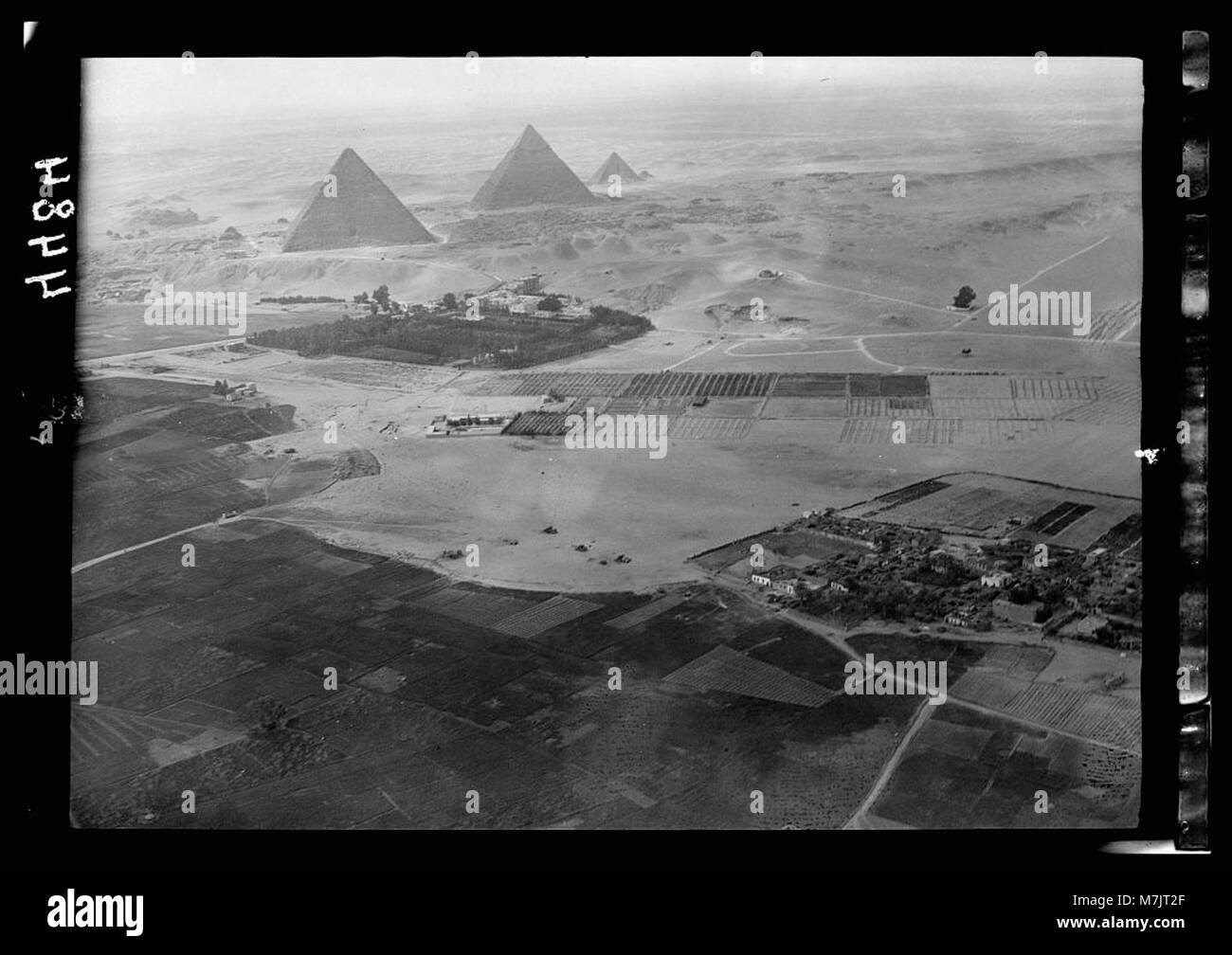 This aerial view captures Cairo and the pyramids, showing their iconic ...