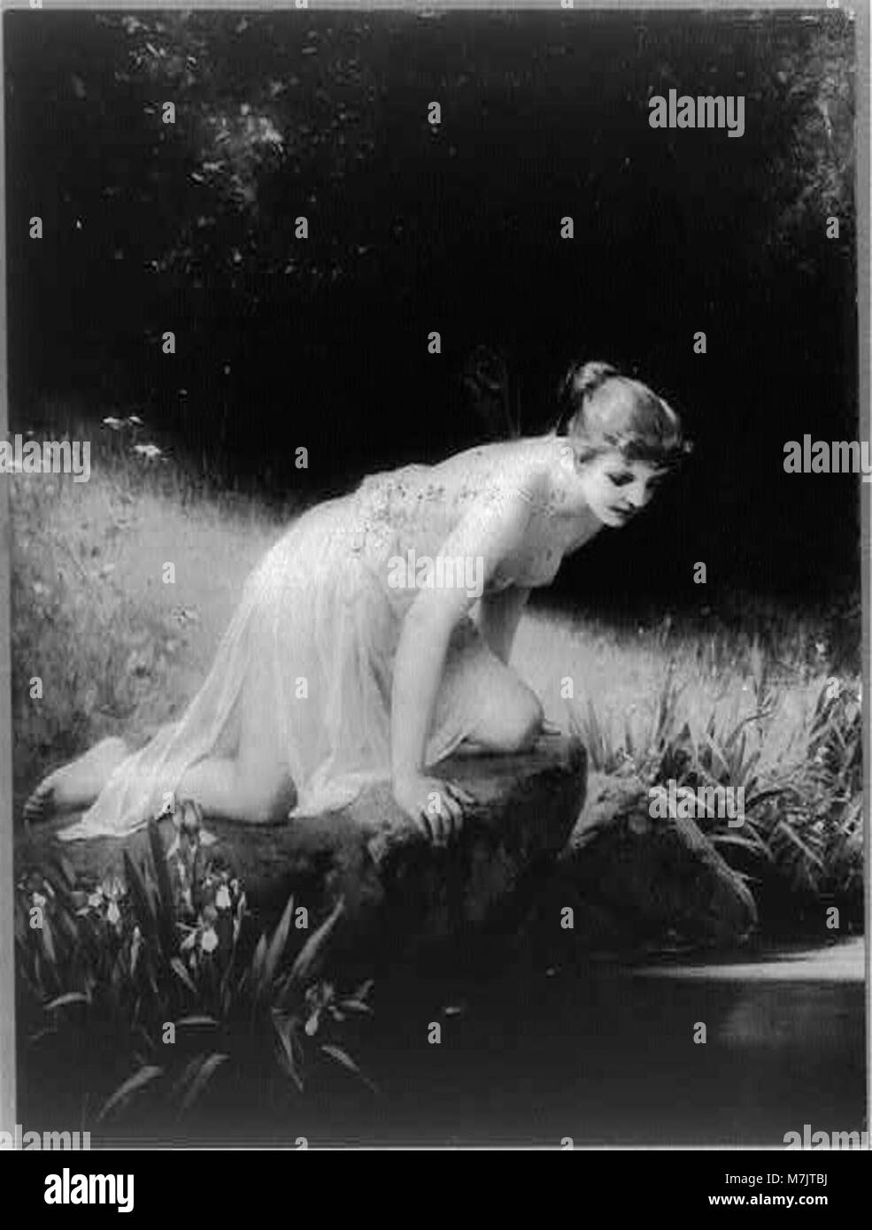 The image portrays Psyche, a figure from Greek mythology, kneeling at ...