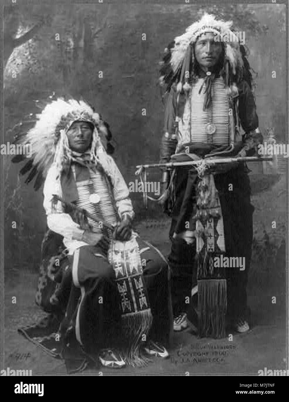 This photograph depicts Sioux warriors, showcasing their traditional ...