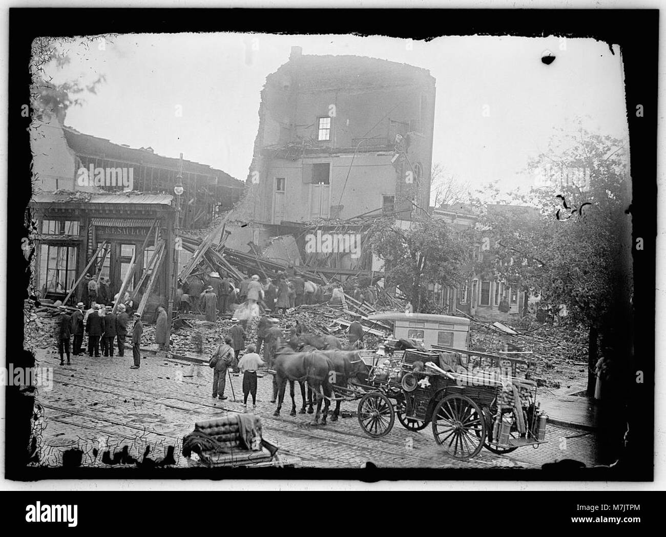 This photograph documents the aftermath of a severe storm, showcasing ...