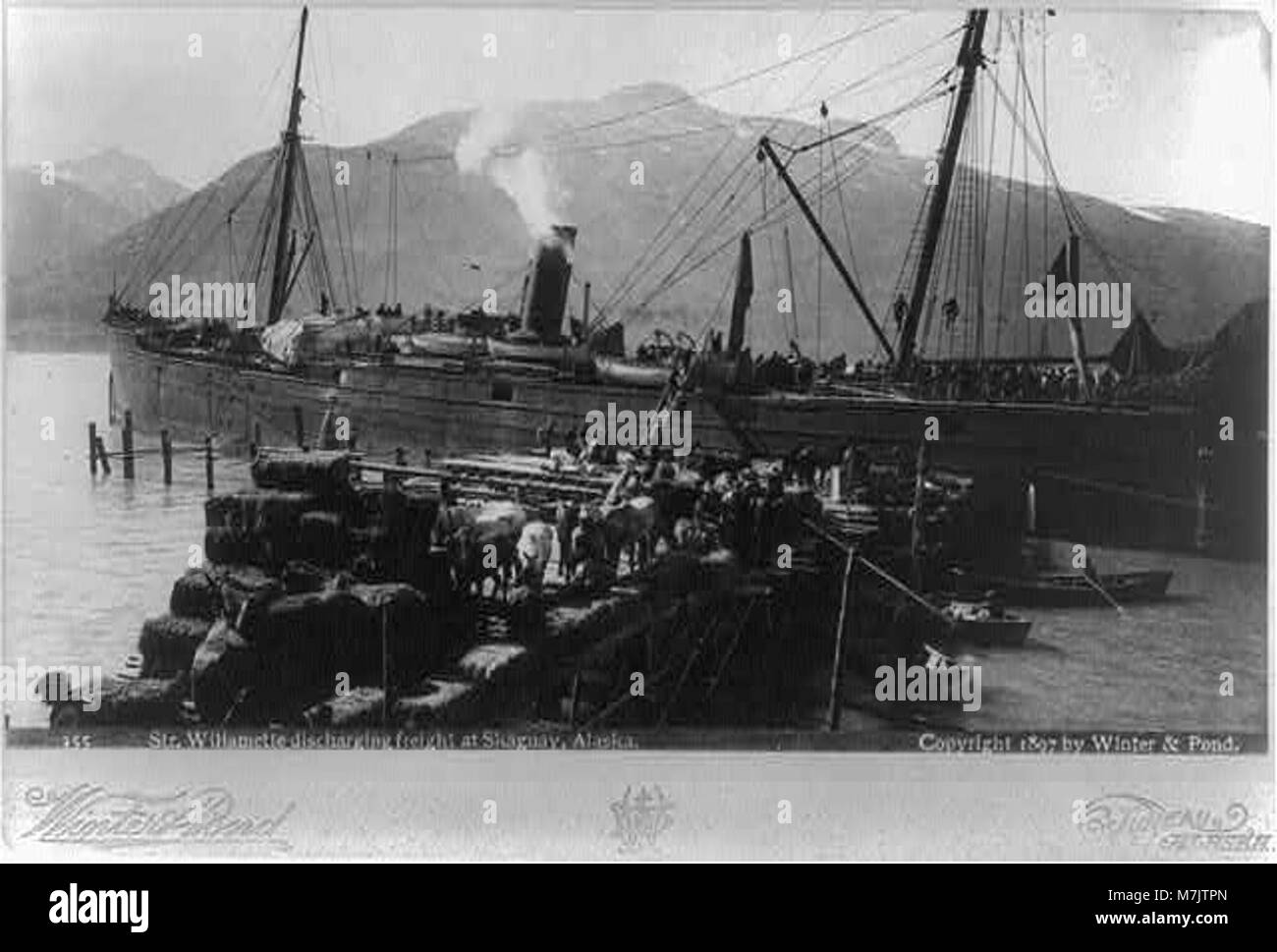 The steamship Willamette is seen unloading freight at Skaguay, Alaska ...